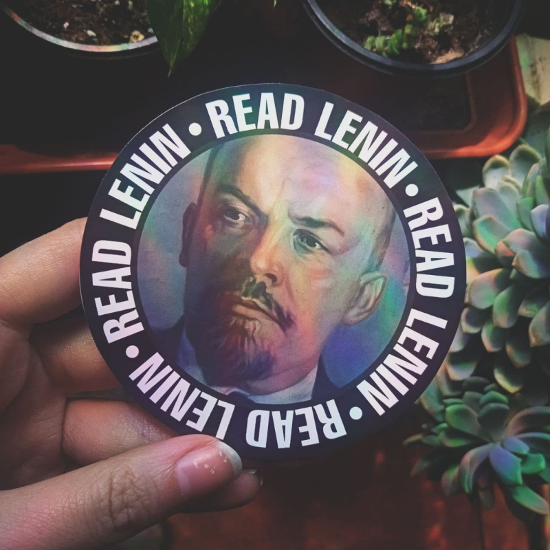 Girl reading what is to be done by Lenin sticker